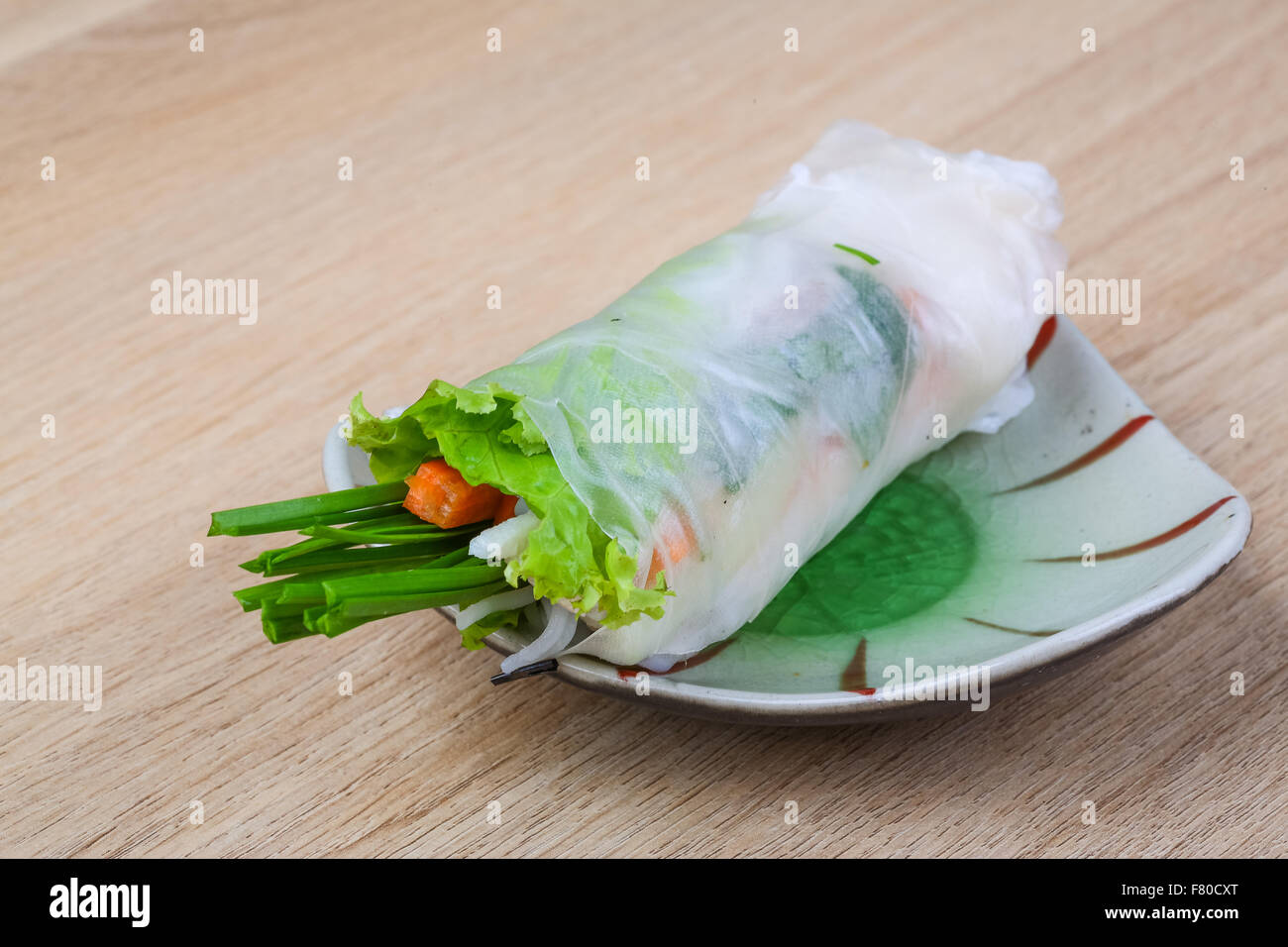 Asian traditional spring rolls on the wood background Stock Photo - Alamy