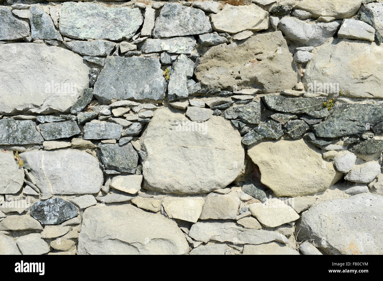 Background of stone wall texture photo Stock Photo - Alamy