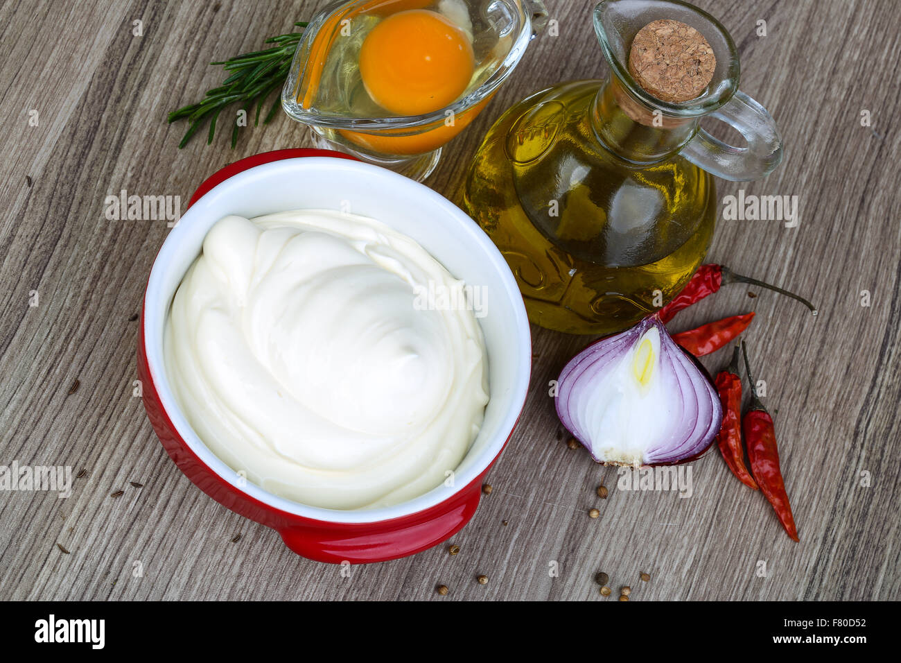Mayonnaise sauce served raw egg, olive oil and rosemary Stock Photo - Alamy
