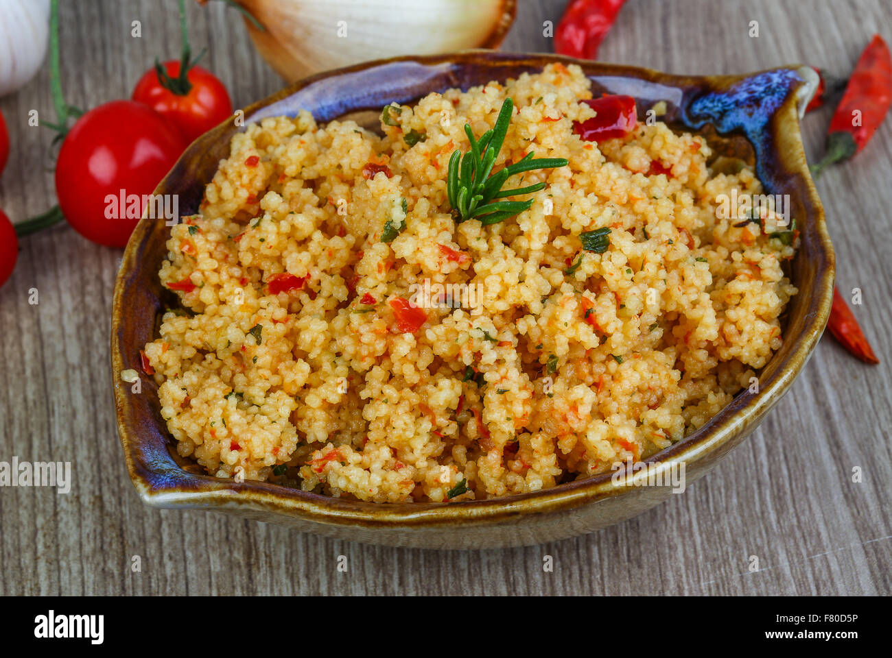 Arabic traditional cuisine - Couscous with tomato and green onion Stock ...