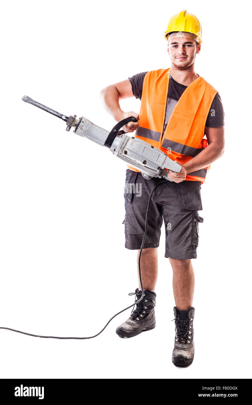a young road worker wearing a hardhat and a visibility vest holding a ...