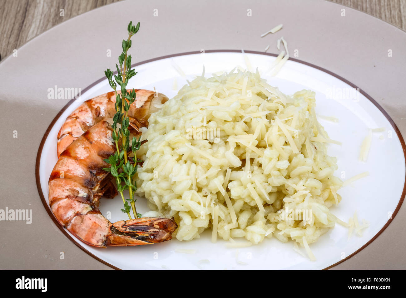 Italian trditional Risotto with tiger prawn and thyme Stock Photo - Alamy