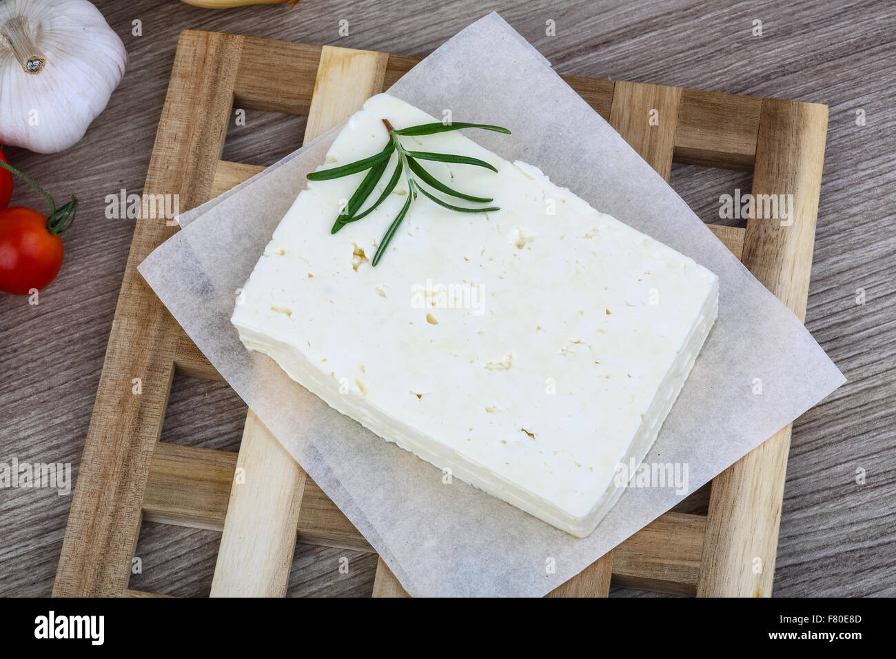 Traditional Caucasian homemade Cheese Brinza with rosemary on wood ...