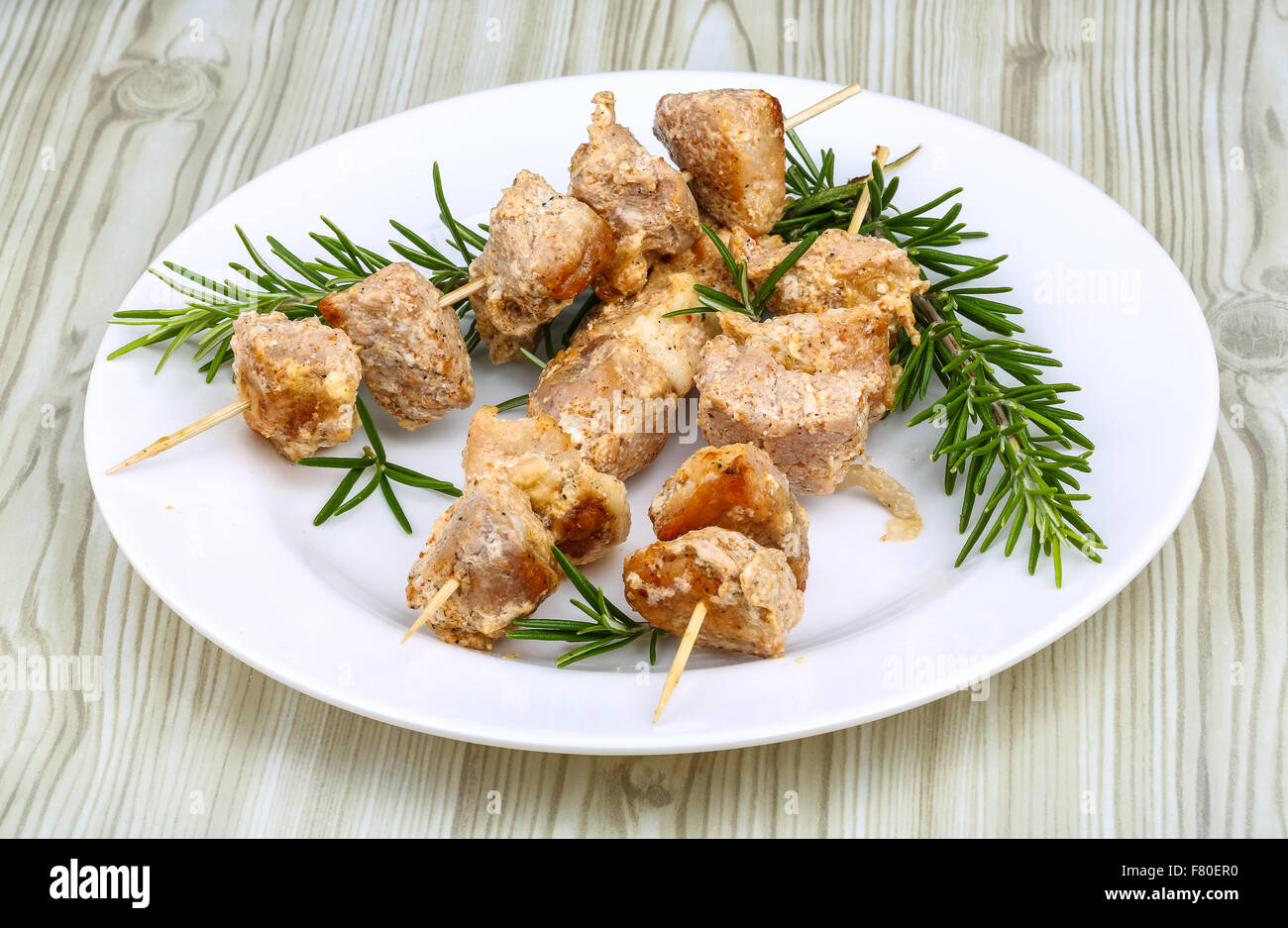 Chicken skewers with rosemary on the wwod background Stock Photo - Alamy