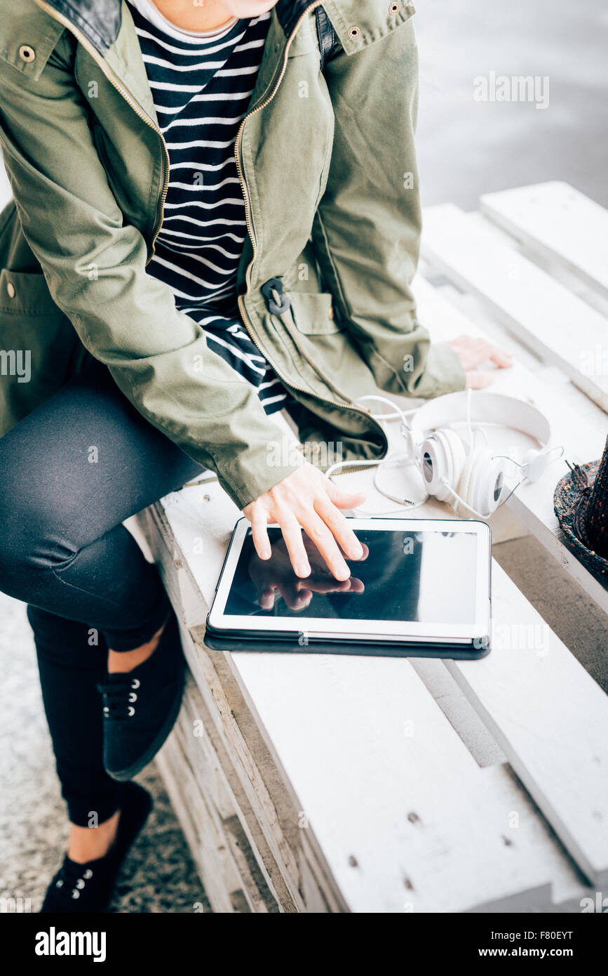 Close up on the hand of young handsome caucasian woman tapping on a ...