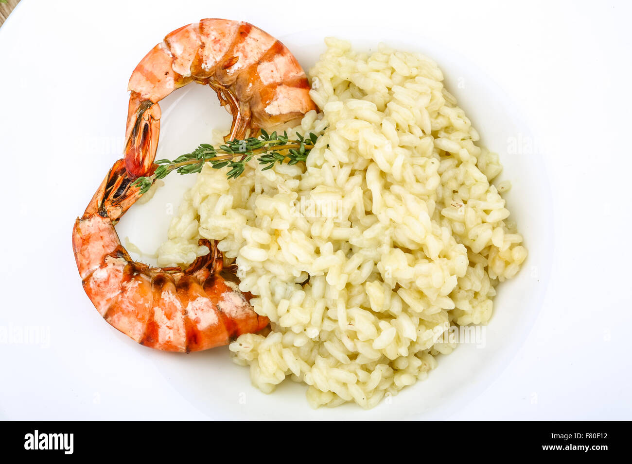 Italian trditional Risotto with tiger prawn and thyme Stock Photo - Alamy