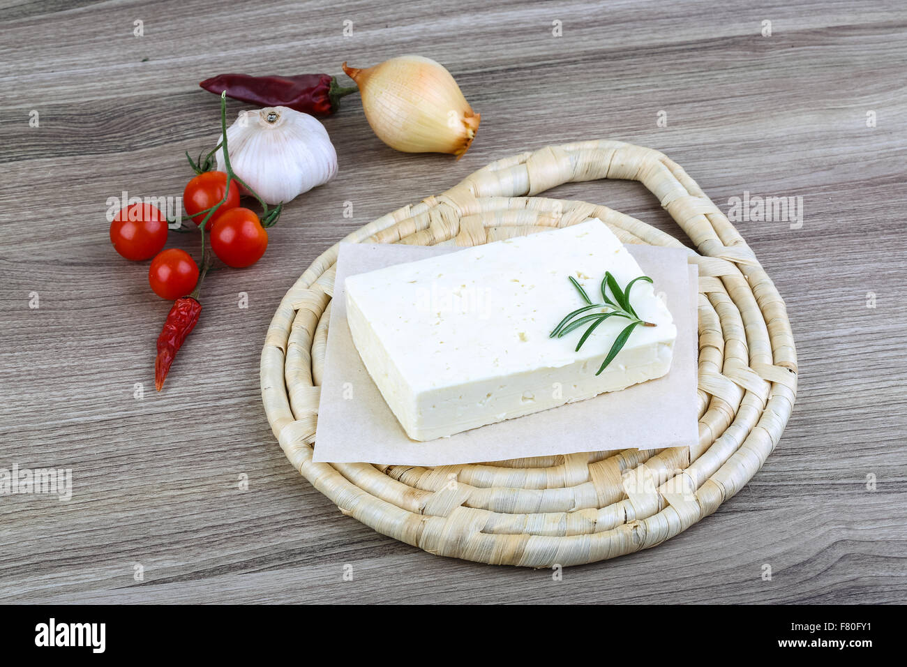 Traditional Caucasian homemade Cheese Brinza with rosemary on wood ...