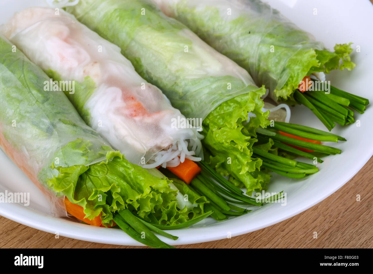 Asian traditional spring rolls on the wood background Stock Photo - Alamy
