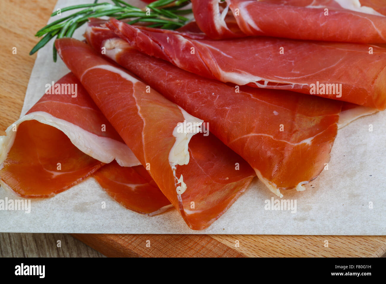 Spanish traditional snack - Jamon with tomato and rosemary Stock Photo ...