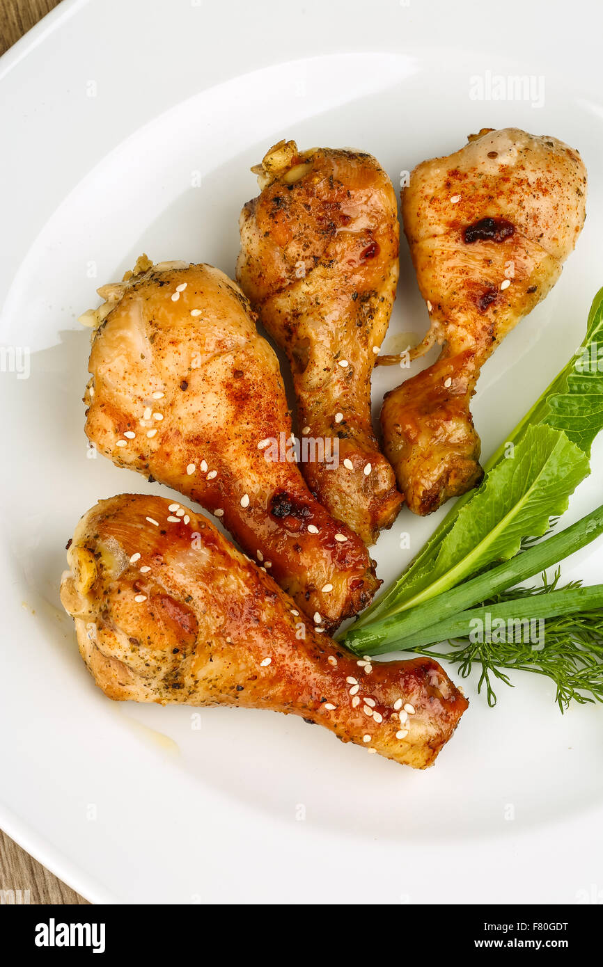 Grilled chicken legs with sesame seeds, dill and green onion Stock ...