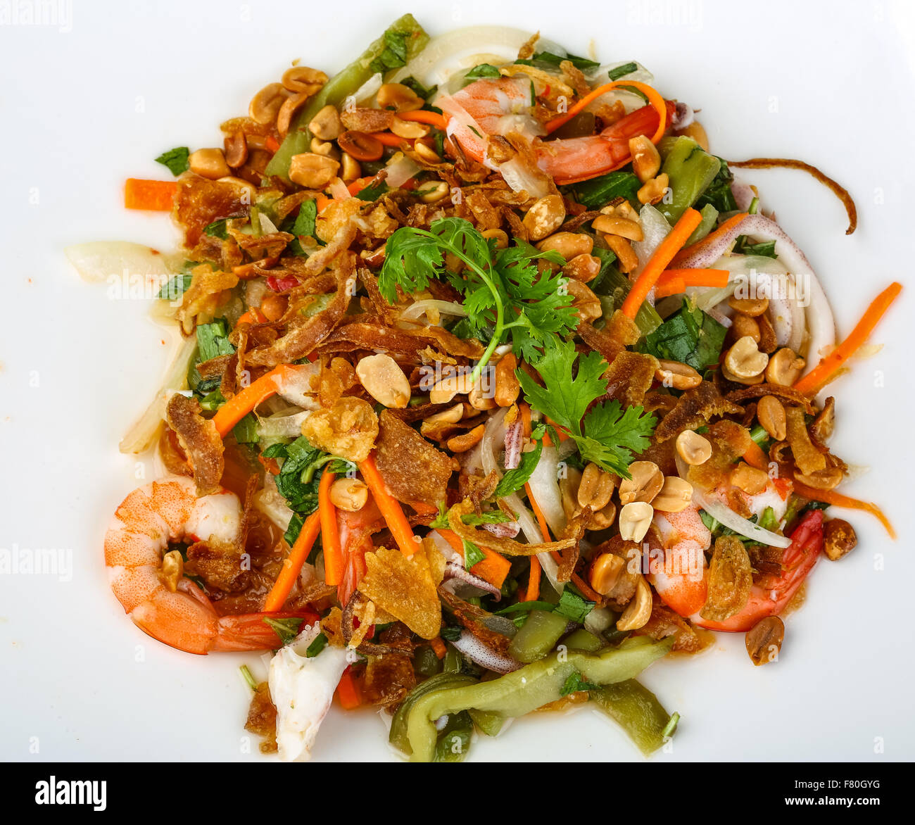 Traditional Asian seafood salad with nuts on wood background Stock ...