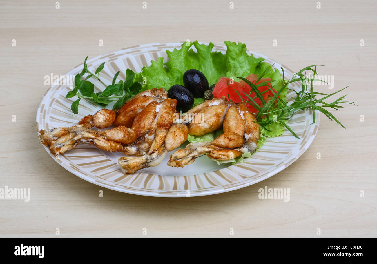 Roasted Frog legs with herbs and spices Stock Photo - Alamy