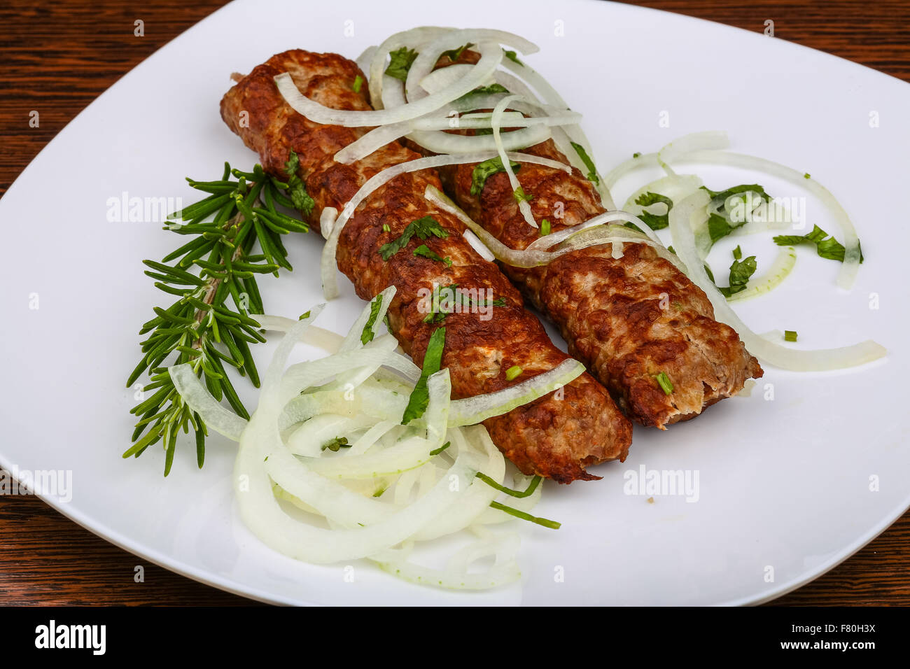 Beef Kebab with onion rings and rosemary Stock Photo - Alamy
