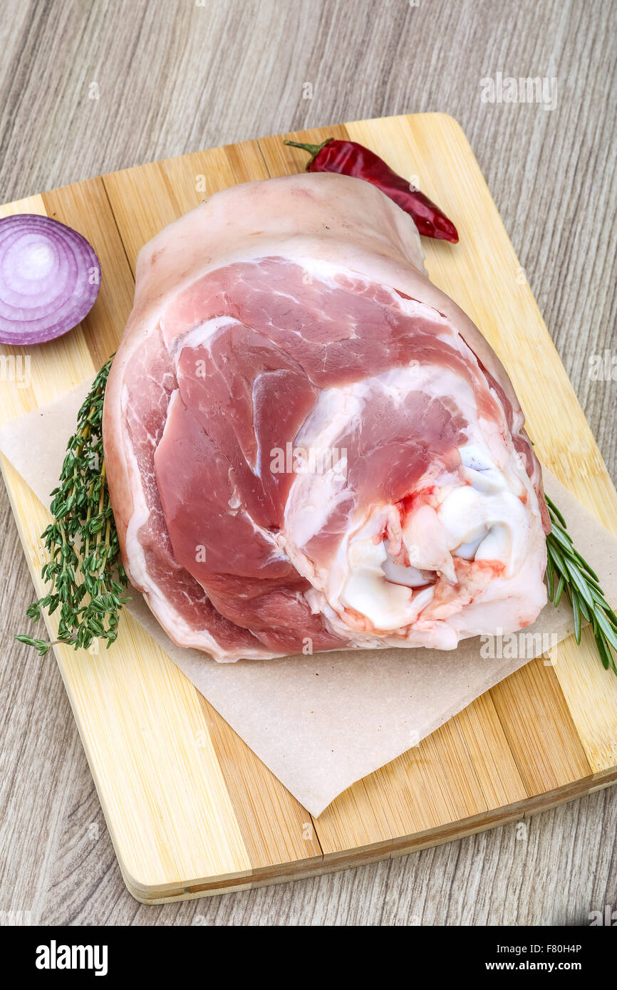 Raw pork knuckle with rosemary, thyme and onion - ready for coocking ...