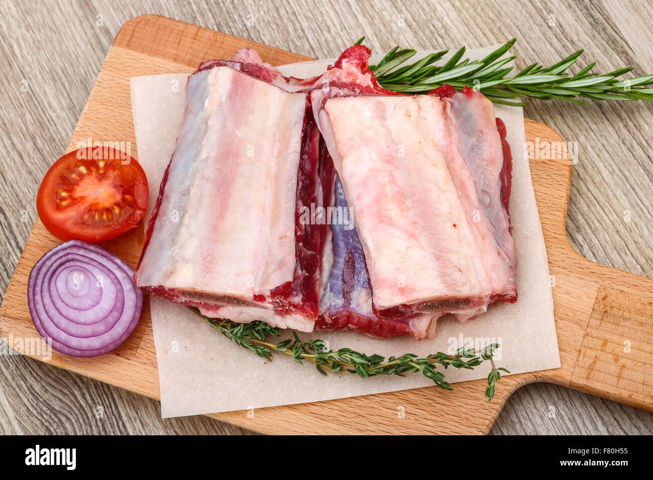Raw beef ribs with rosemary and thyme - ready for cooking Stock Photo ...