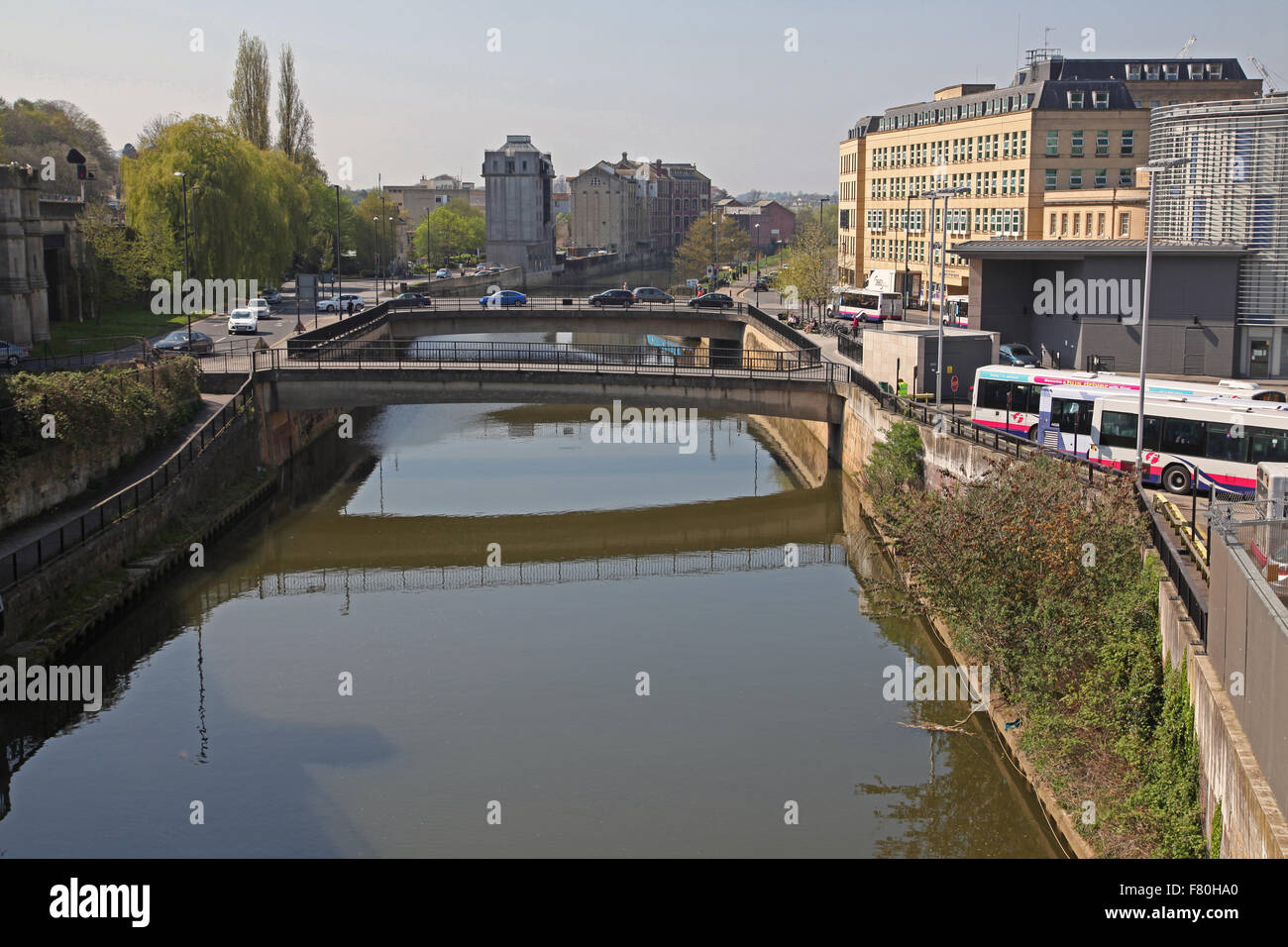Looking along the river with vehicles crossing over on the bridges ...