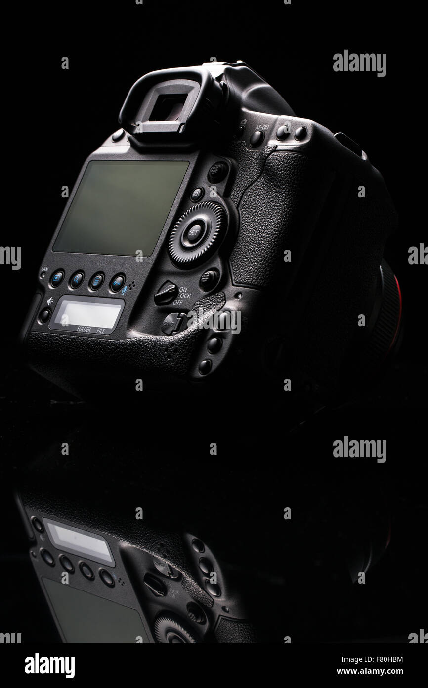 Professional modern DSLR camera low key image - Modern DSLR camera with ...