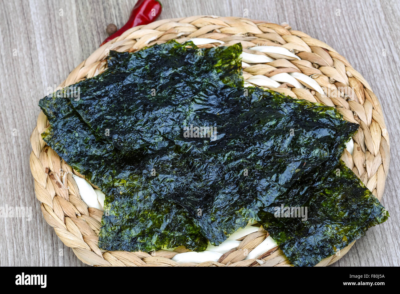 Korean traditional snack - Nori seaweed sheets on the wood background ...