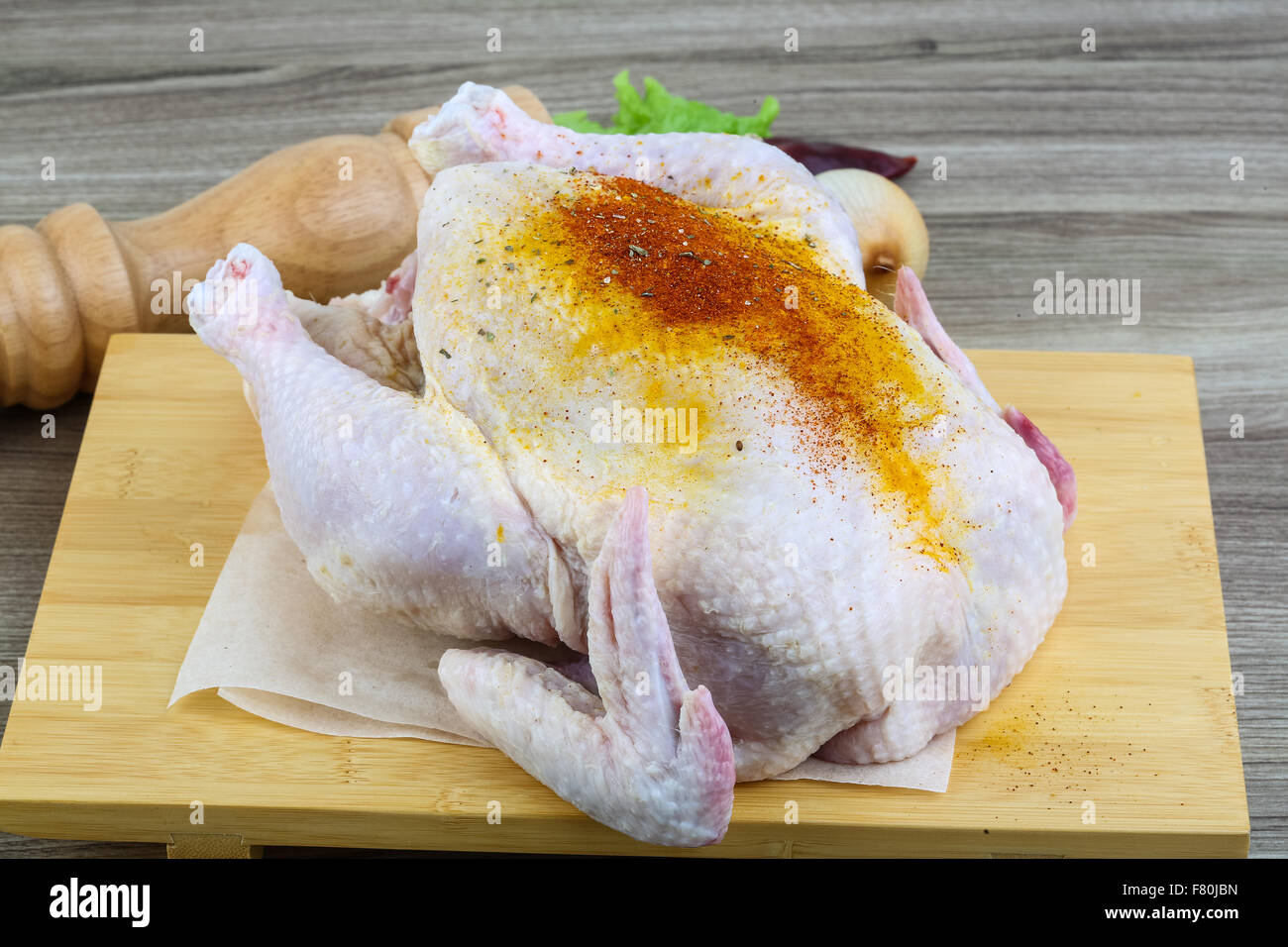 Raw chicken with spices ready for cooking Stock Photo - Alamy