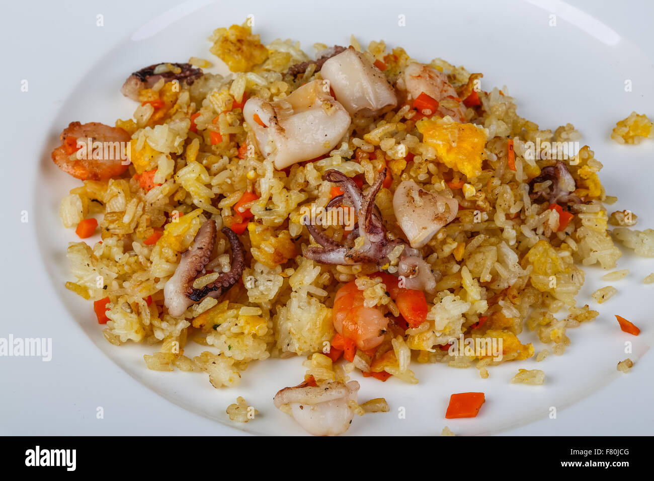 Asian traditional Fried rice with seafood on the wood background Stock ...