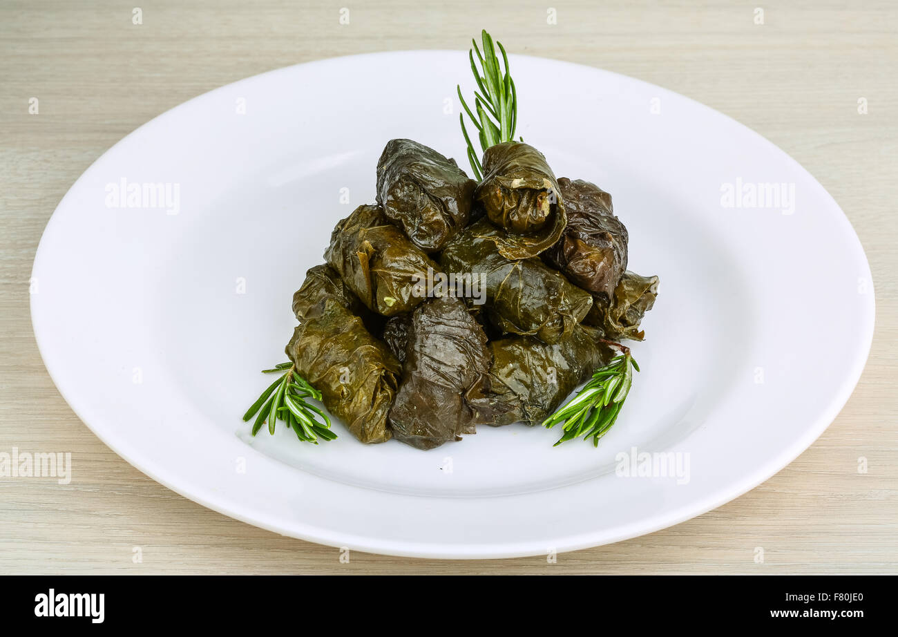 Greek dolma in grape leaves with meat served rosemary Stock Photo - Alamy