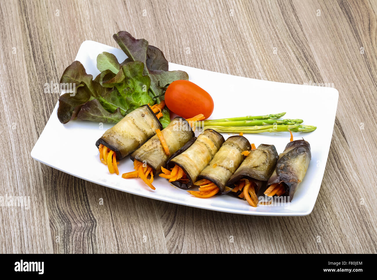 Eggplant rolls with carrot served spices and coriander Stock Photo - Alamy