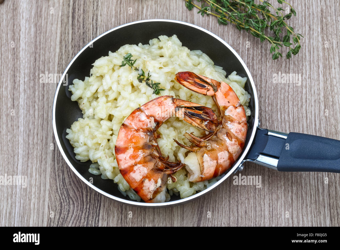 Italian trditional Risotto with tiger prawn and thyme Stock Photo - Alamy