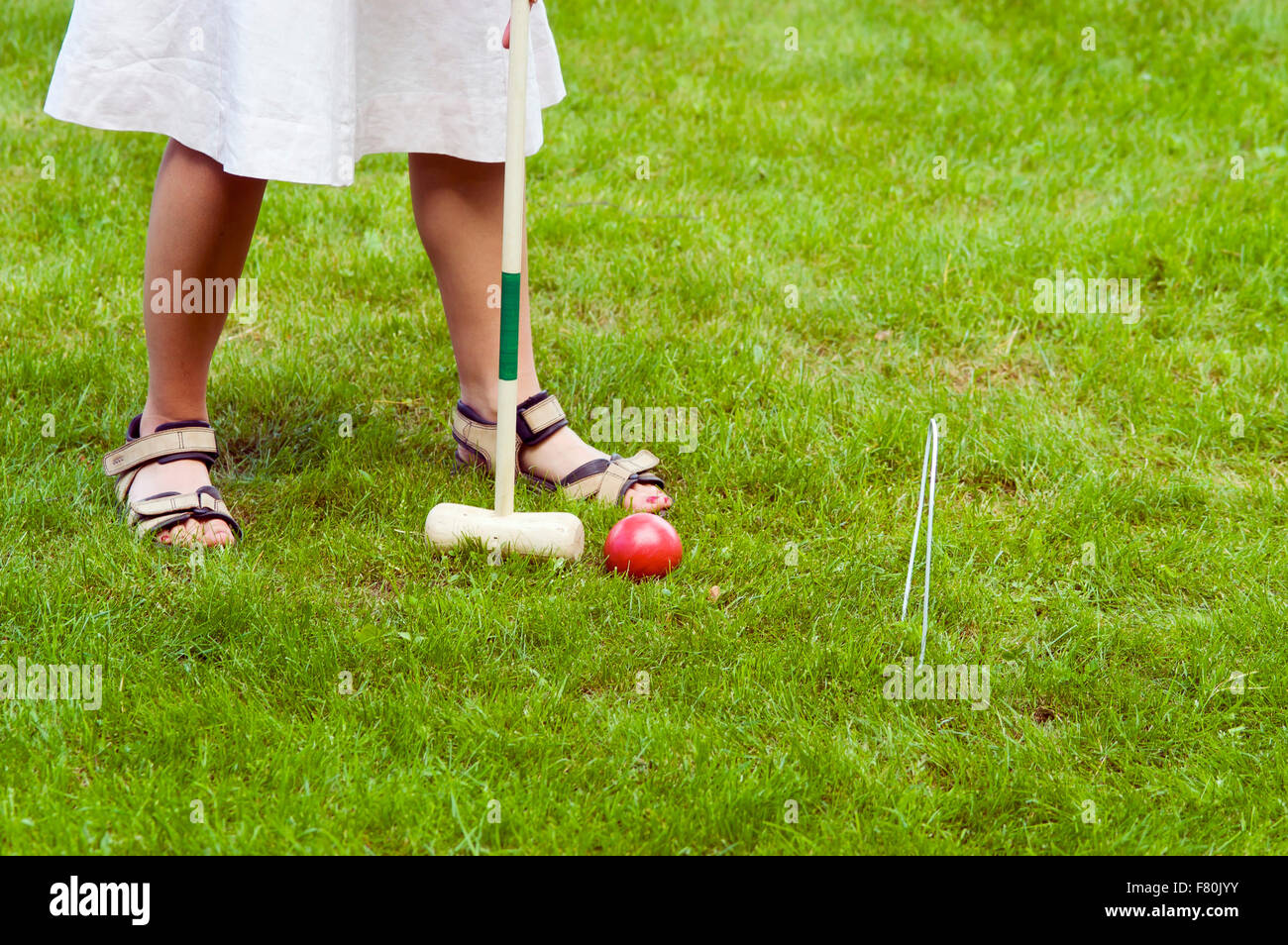 Girl playing croquet hi-res stock photography and images - Alamy