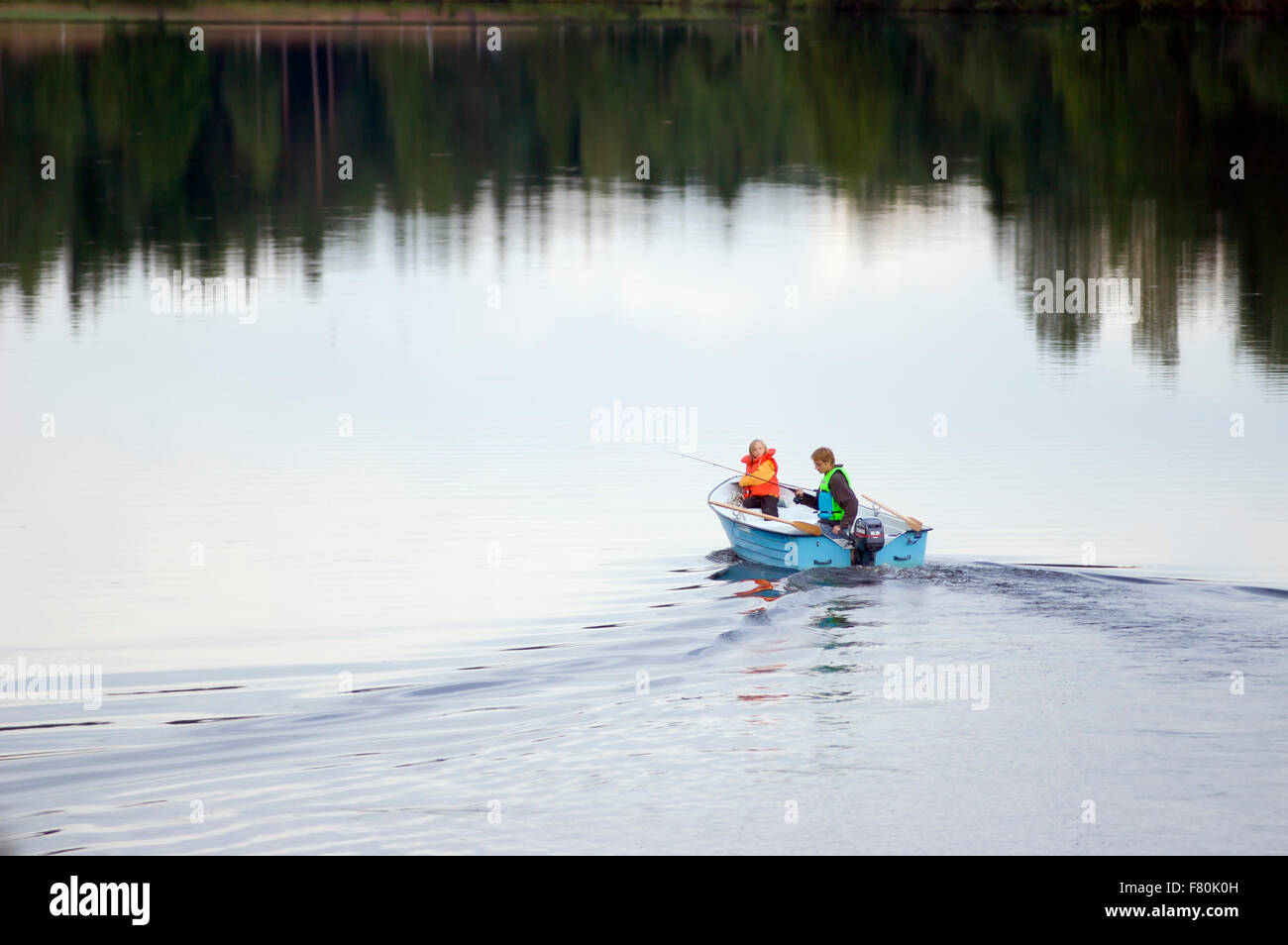 Fishing from small boat Stock Photo - Alamy