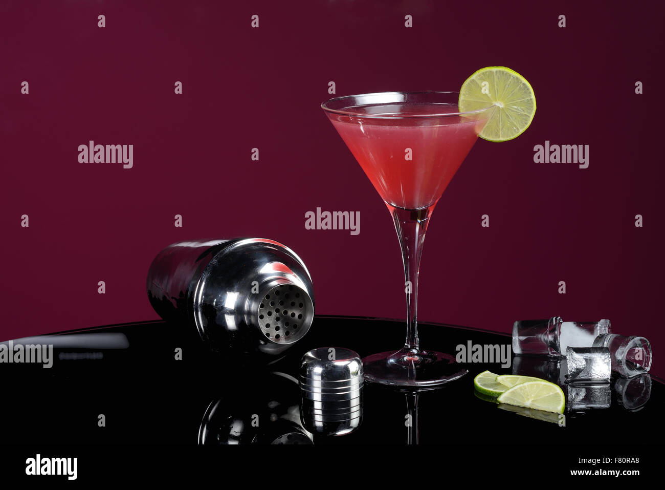 Red cocktail cosmo cosmopolitan martini glass barman hi-res stock ...