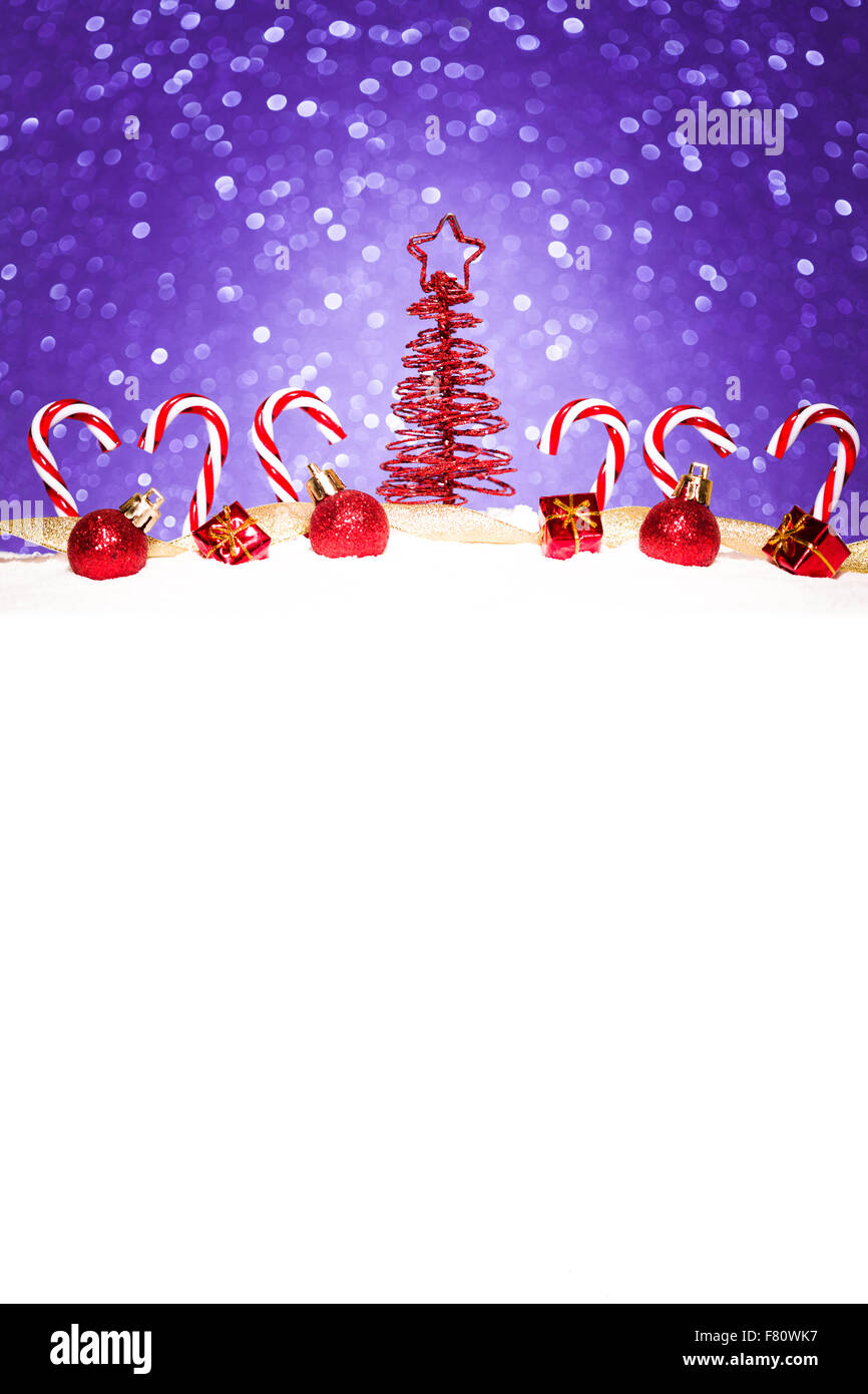 christmas tree in snow on glitter background Stock Photo - Alamy