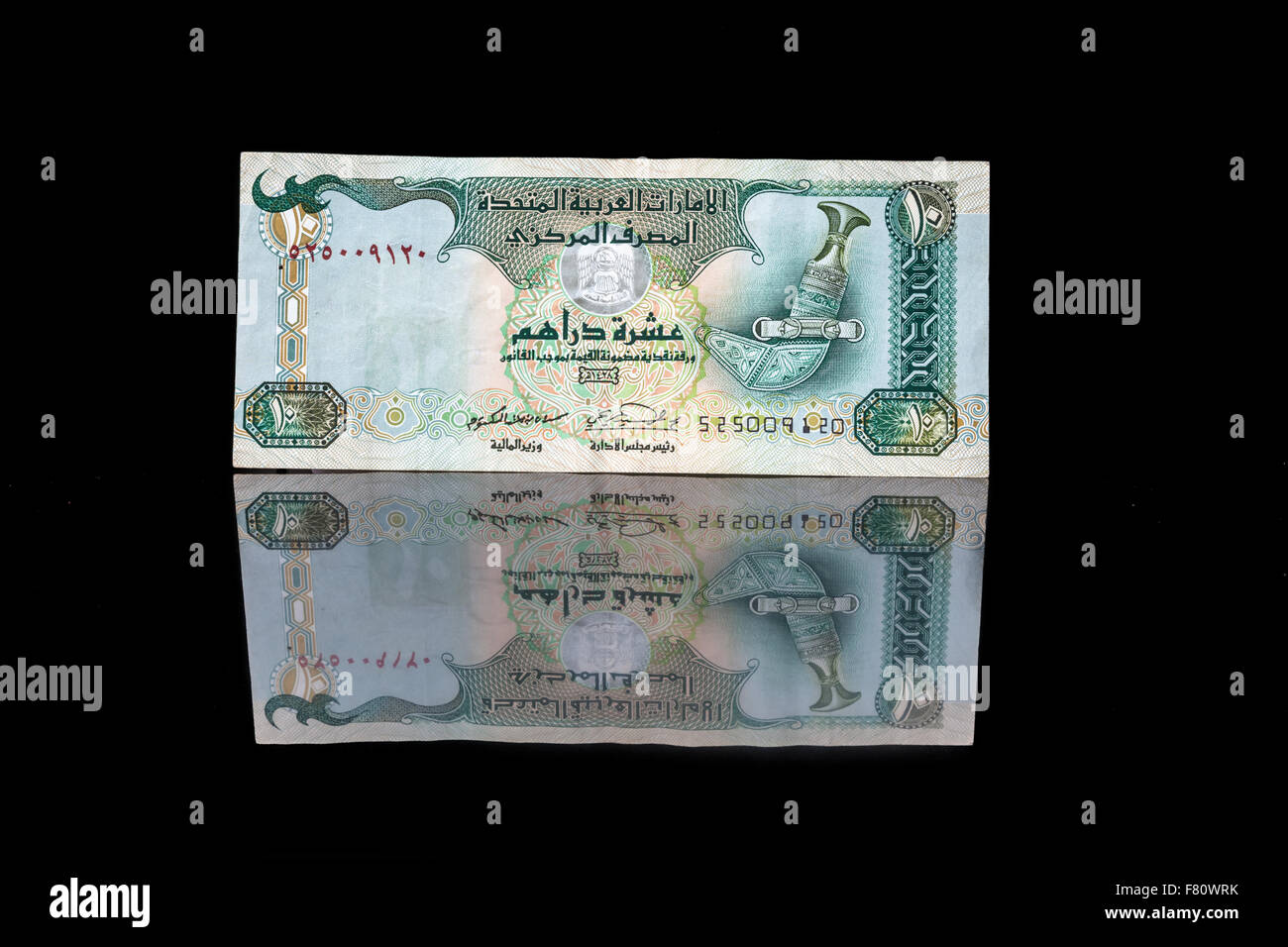 ten dirhams bill in reflection on black Stock Photo - Alamy