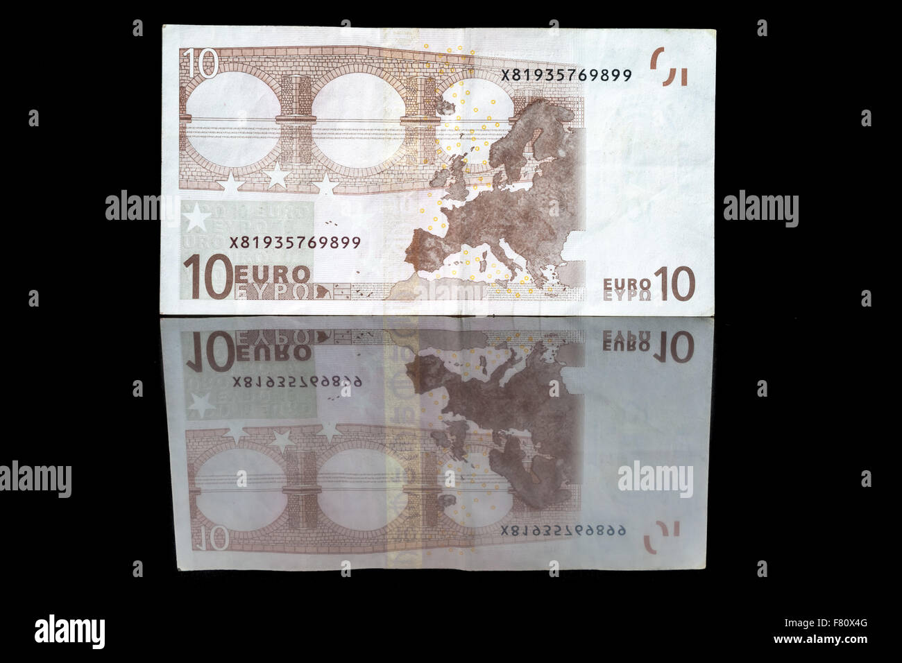 Ten euro bill in reflection on black Stock Photo - Alamy