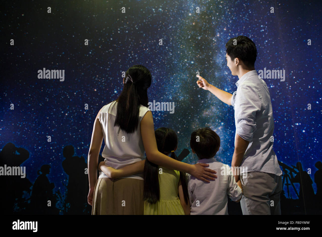 Young family in science and technology museum Stock Photo - Alamy