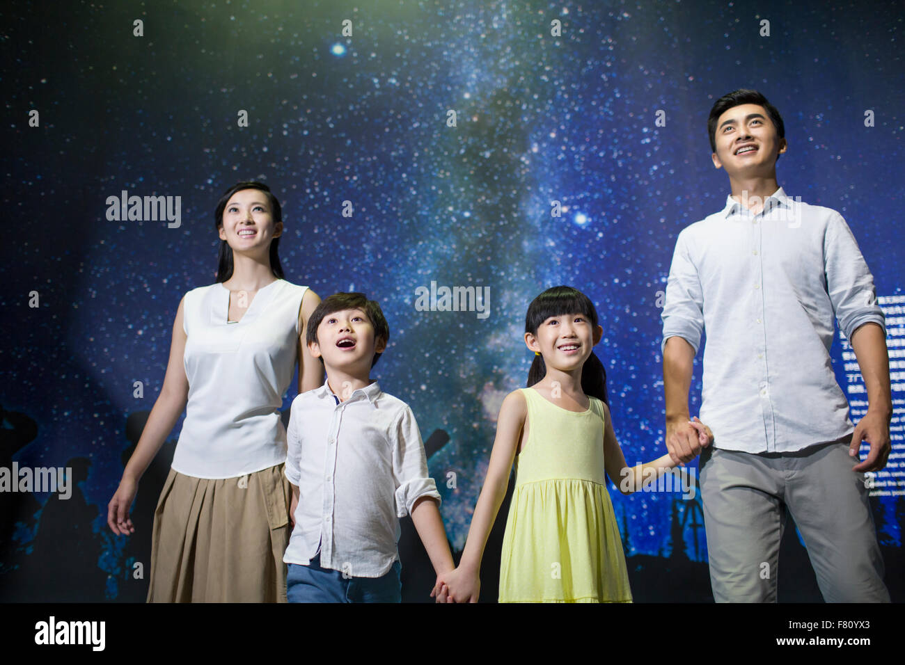 Young family in science and technology museum Stock Photo - Alamy