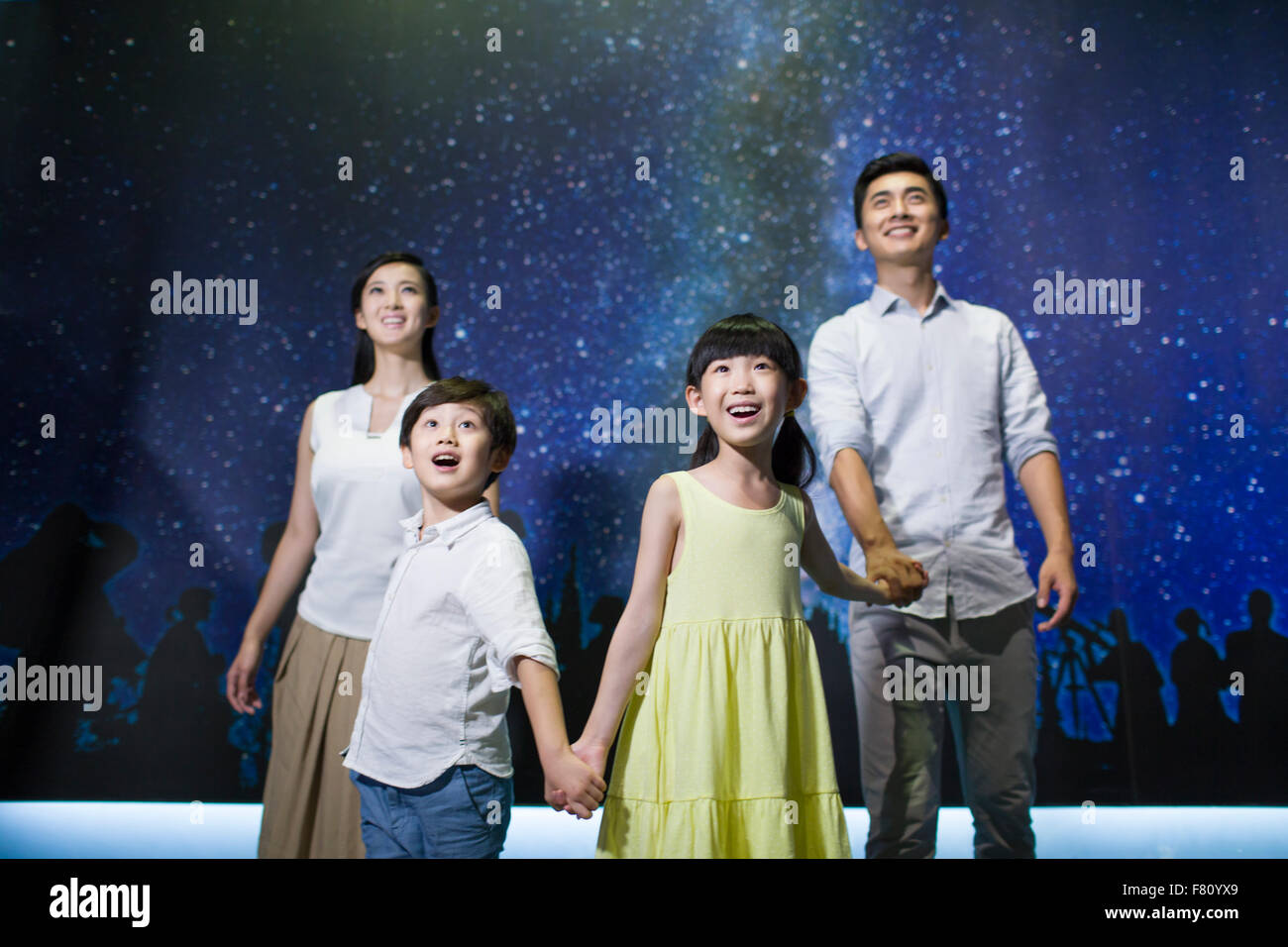 Young family in science and technology museum Stock Photo - Alamy