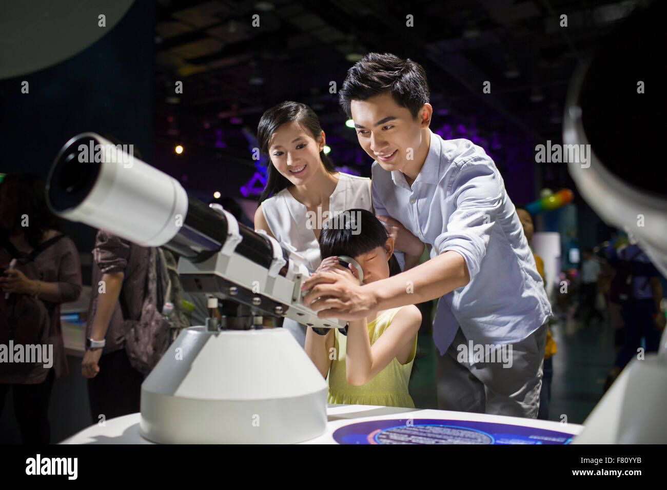 Young family in science and technology museum Stock Photo - Alamy
