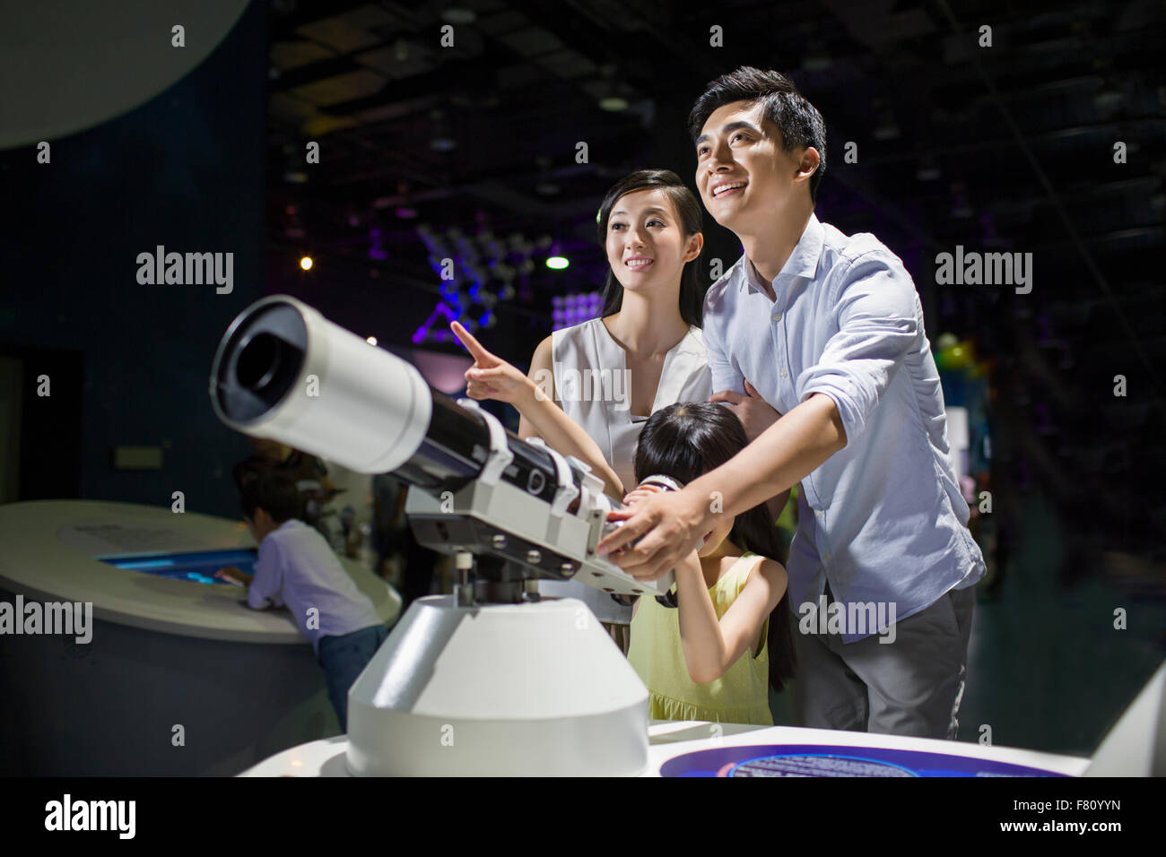 Young family in science and technology museum Stock Photo - Alamy