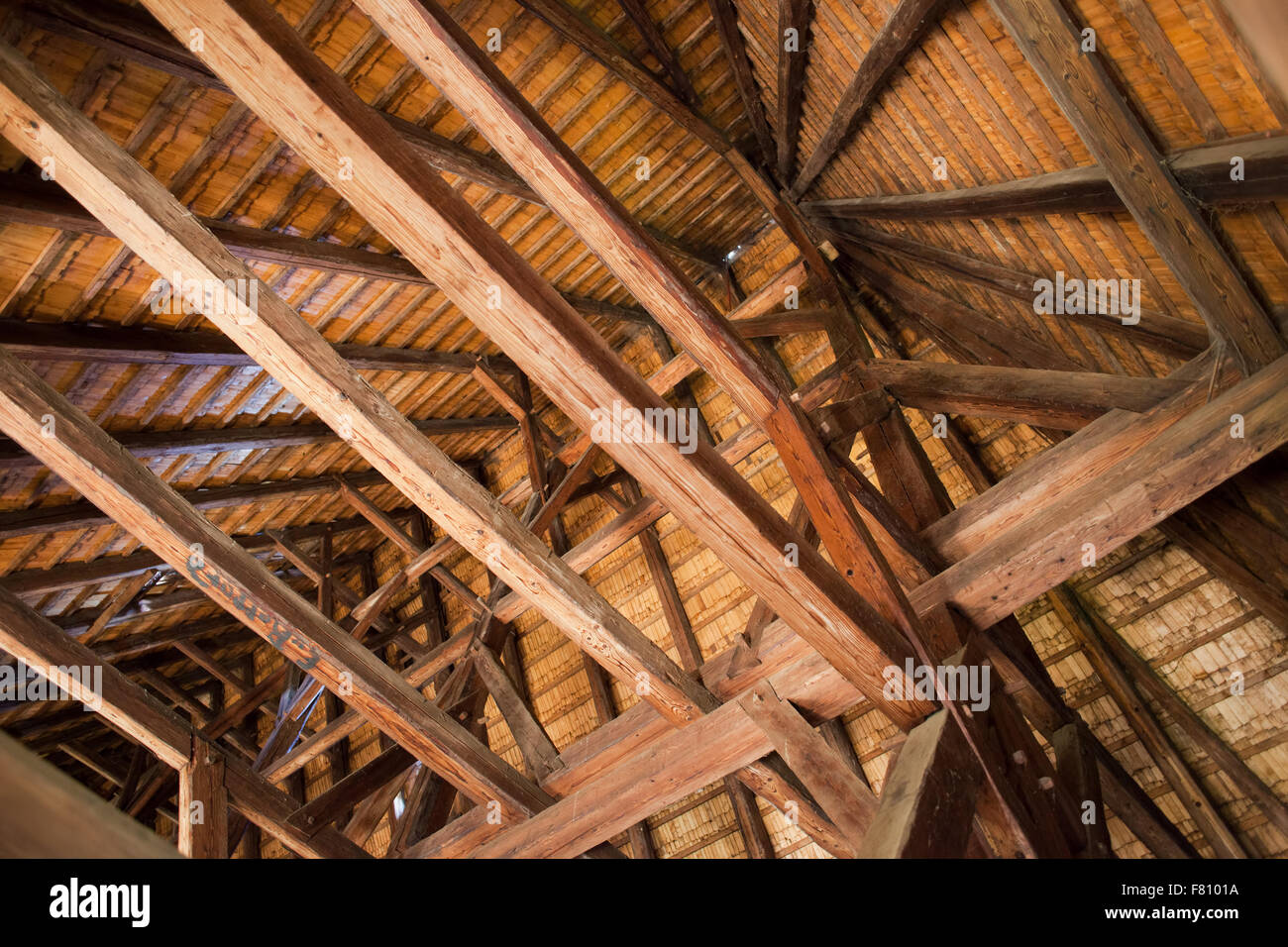 Attic interior wooden ceiling with supporting logs of Ducal Tower ...