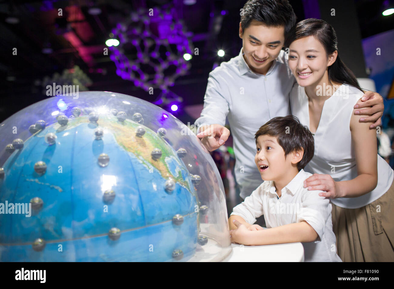 Young family in science and technology museum Stock Photo - Alamy