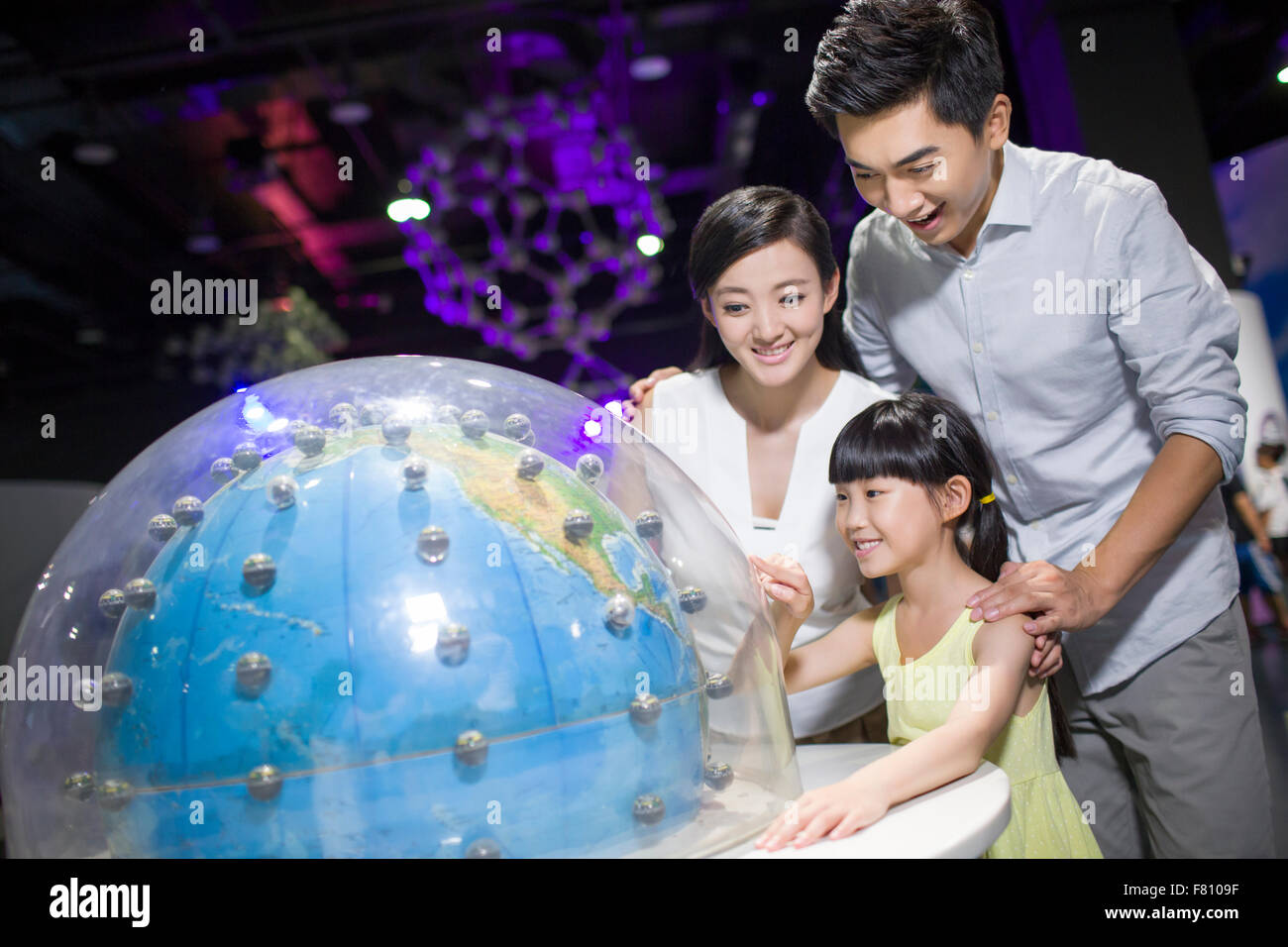 Young family in science and technology museum Stock Photo - Alamy