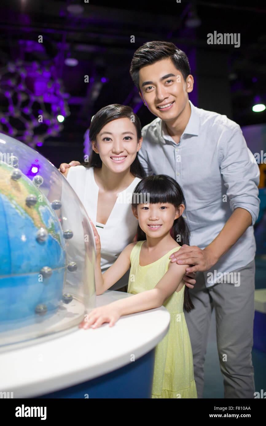Young family in science and technology museum Stock Photo - Alamy