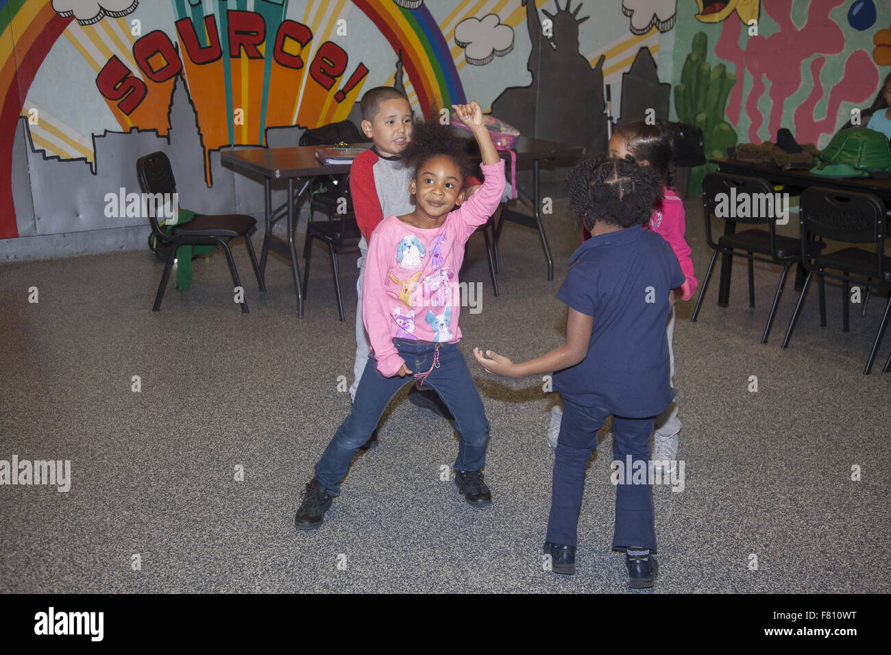 Children have fun dancing at a community center after school program ...