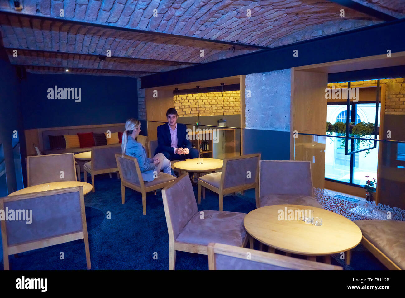 young business people couple relaxing after work in bar restaurant and ...
