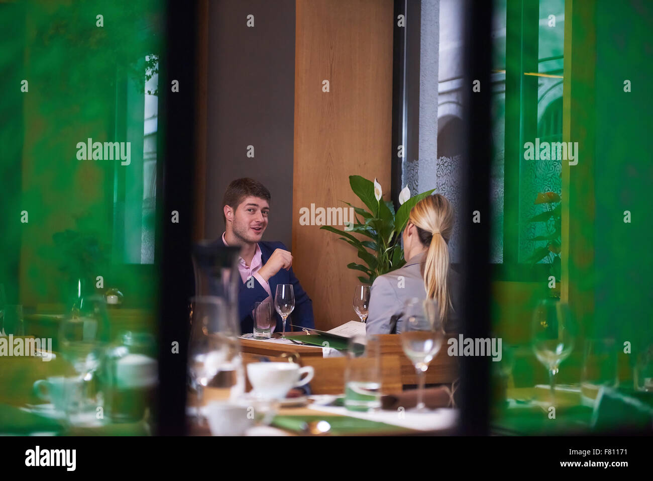 business people meeting in modern restaurant, romantic couple having ...