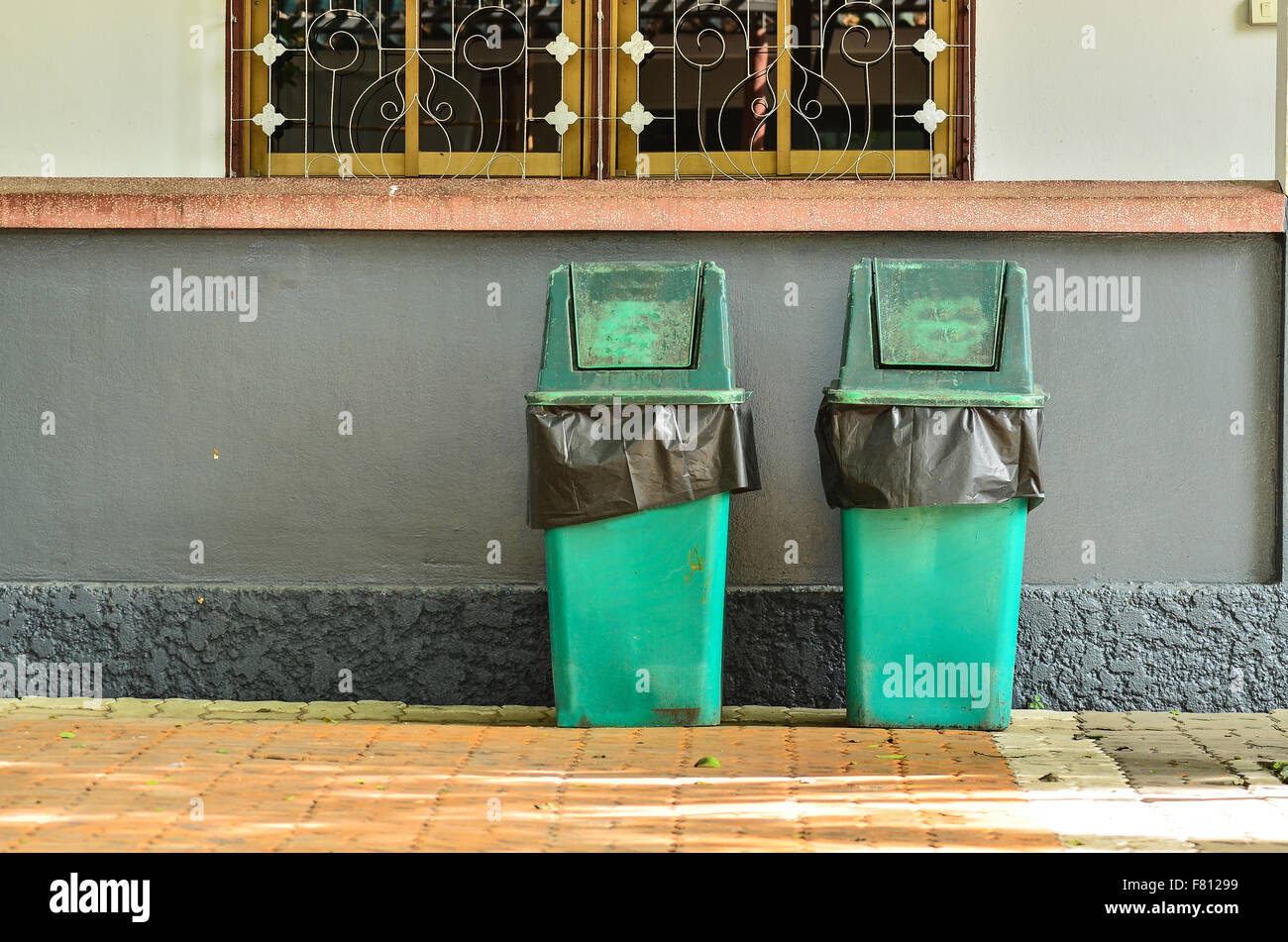 Green trashcan for keeping garbage Stock Photo - Alamy