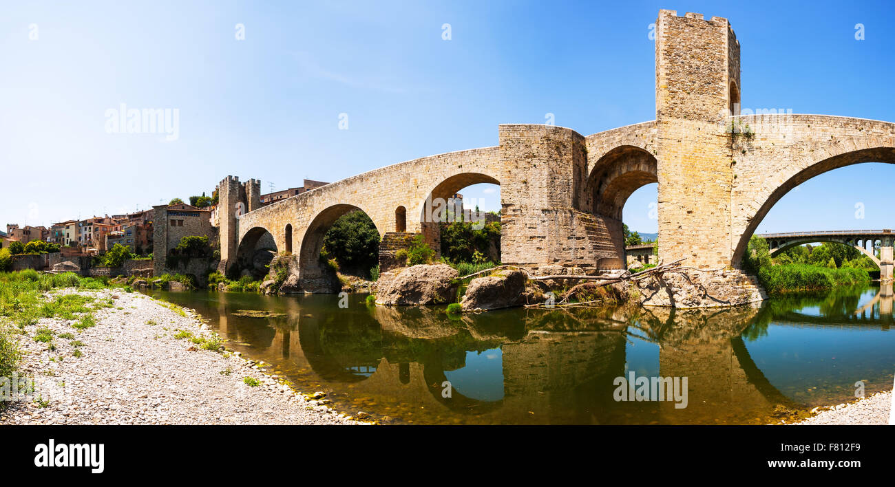 Panoramic view of 12th-century Romanesque bridge over the Fluvia river ...