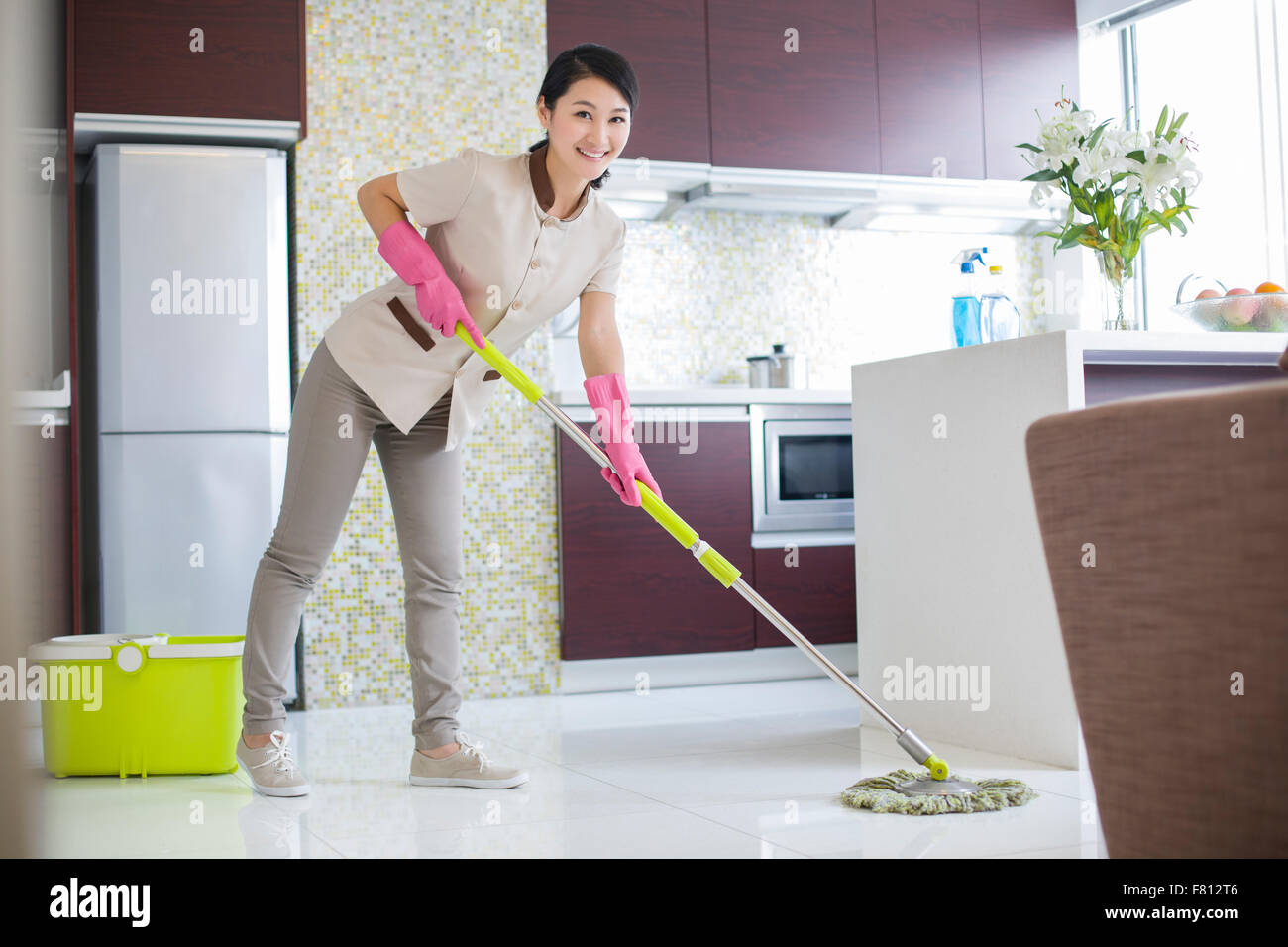 Woman doing housework scrubbing floor hi-res stock photography and ...