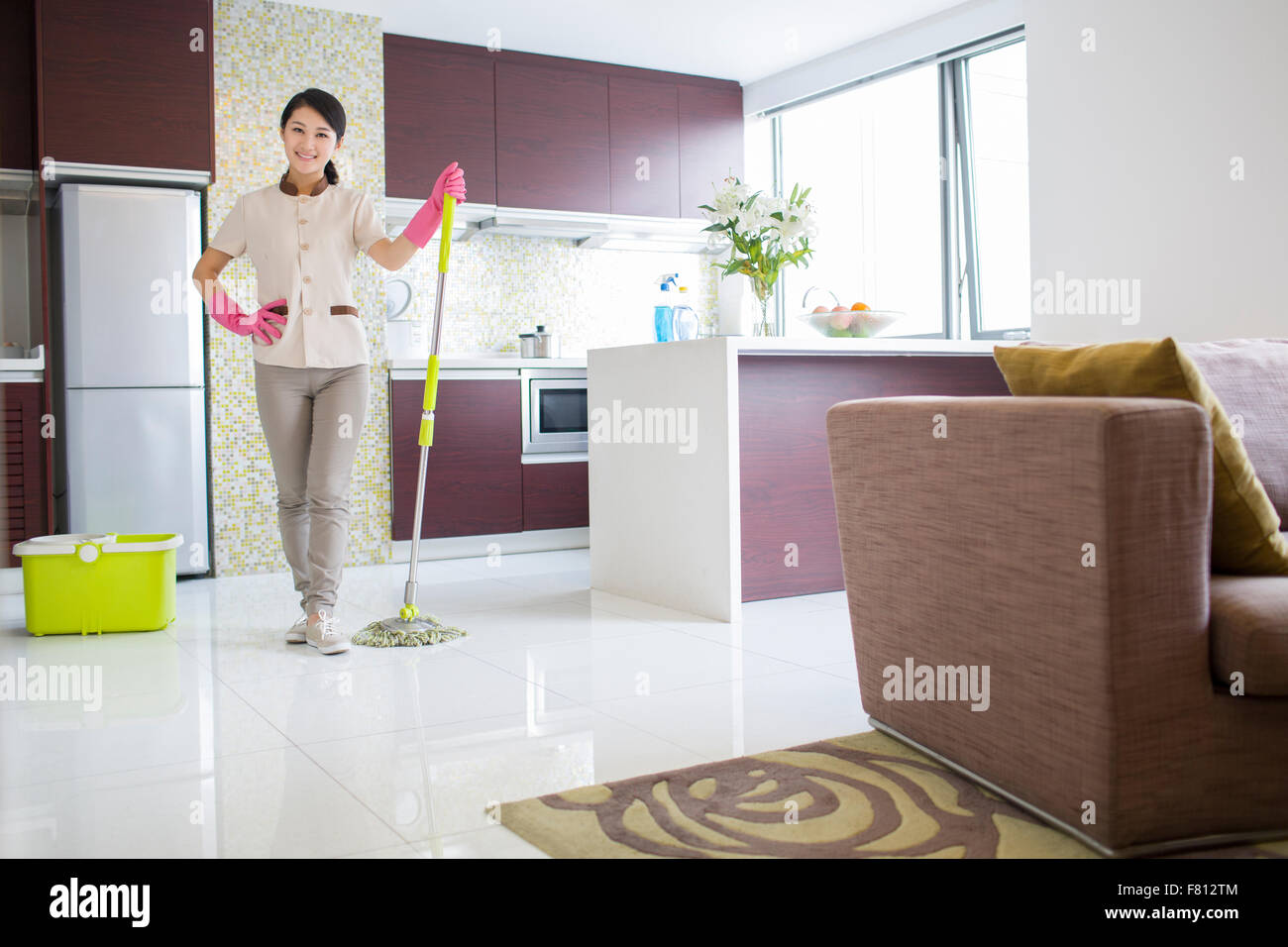 Woman doing housework scrubbing floor hi-res stock photography and ...