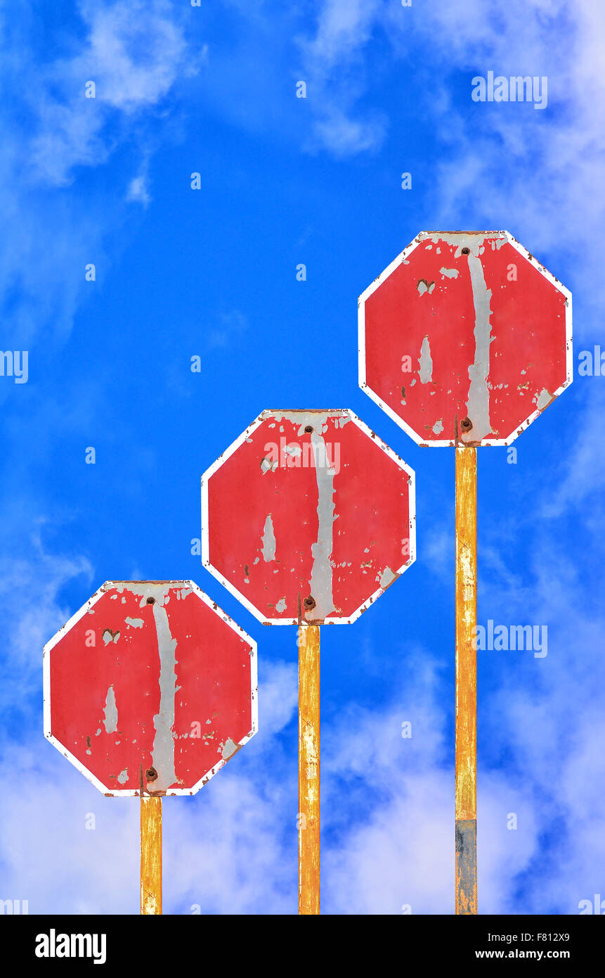 Many Old Traffic Signs on blue sky background Stock Photo - Alamy